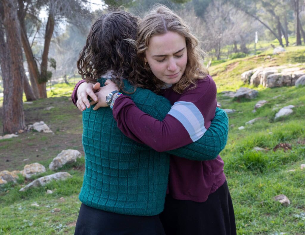 Young woman crying and hugging friend – The Jewish Life Photo Bank