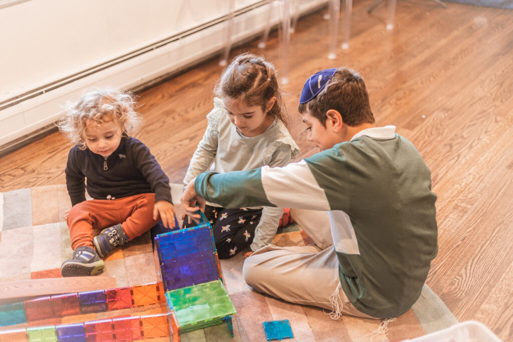 Kids playing magnet game – The Jewish Life Photo Bank